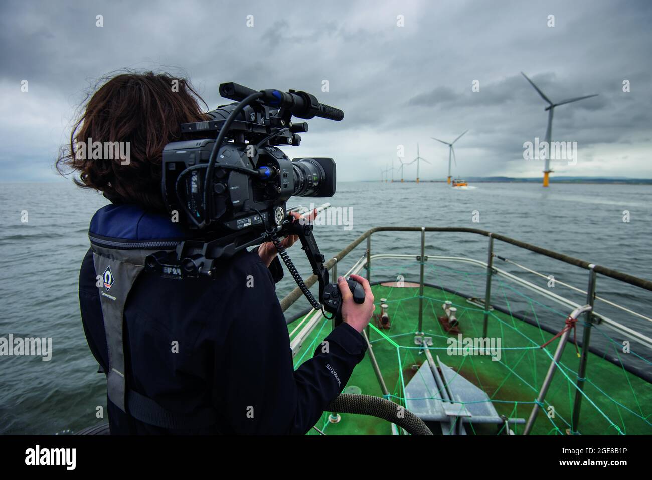 Female camera operator filming with a sony camera from a boat Stock ...