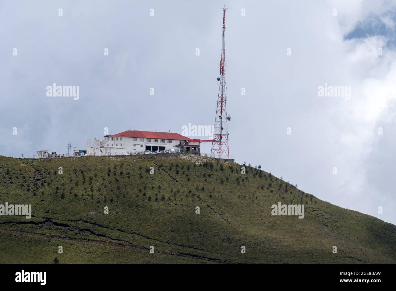 Electric tower near the Iztaccihuat volcano and a cloudy sky in Mexico ...