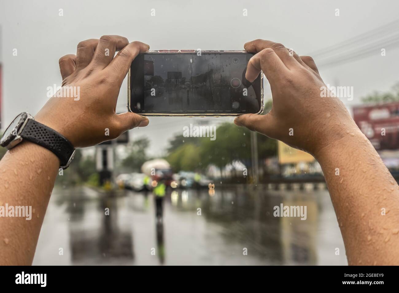 Kendari, Indonesia. 17th Aug, 2021. A police officer takes pictures of ...