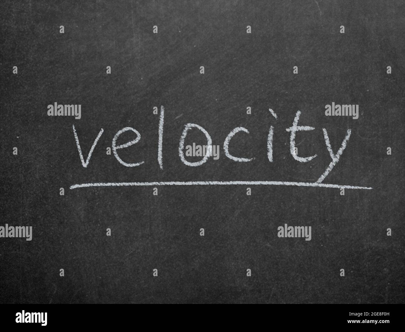 velocity concept word on blackboard background Stock Photo - Alamy
