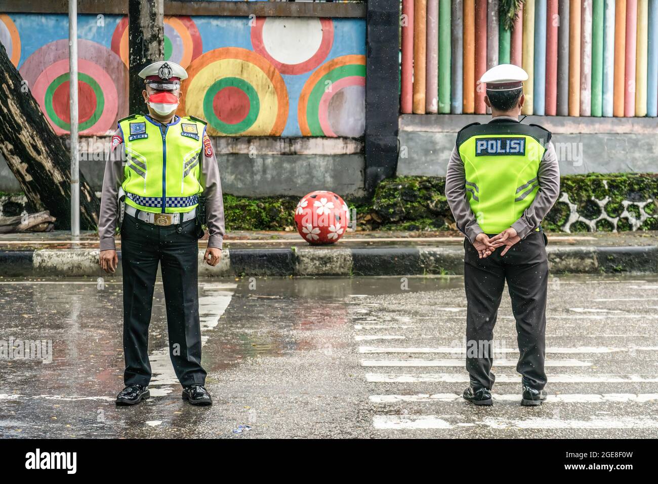 Kendari, Indonesia. 17th Aug, 2021. A traffic police officer stands ...