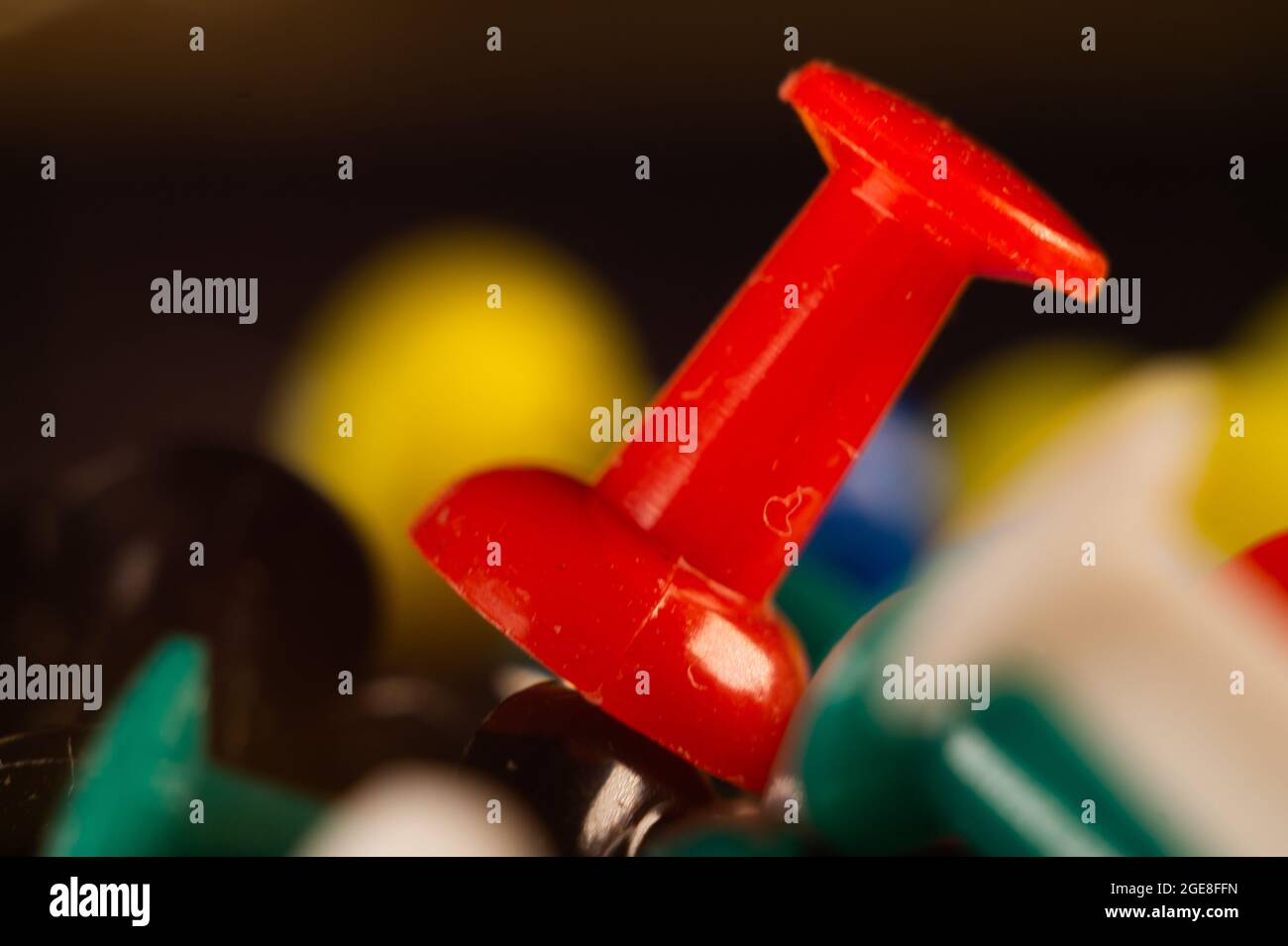 Red stationary pin in a pile Stock Photo - Alamy