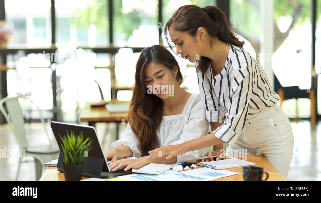 Creative business female sharing her ideas to colleague in the meeting ...