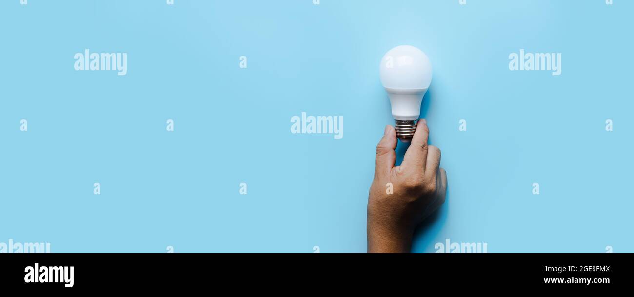 Idea and creative innovation light bulb on blue background Stock Photo ...
