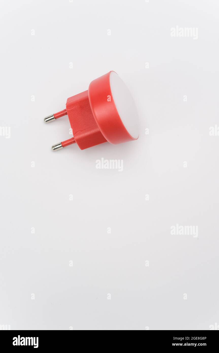 Vertical high angle shot of a lamp with a plug on a white surface Stock ...