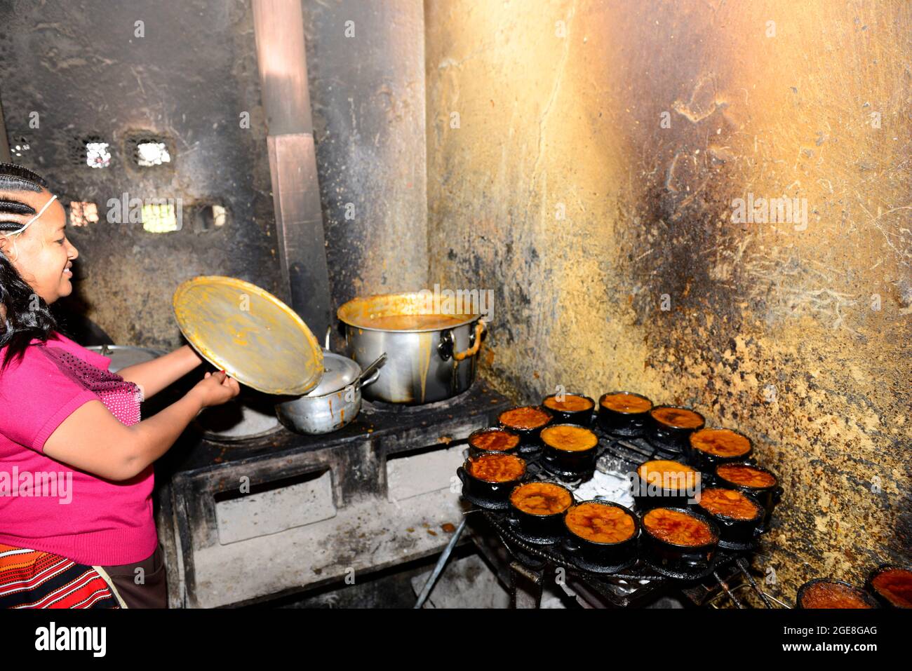 A cook with the various vegetables prepared for the injera dish at the ...