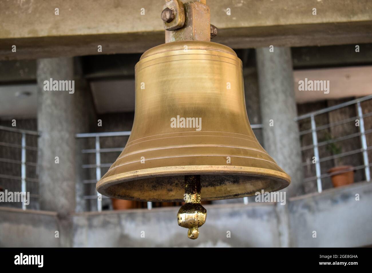 Selective focus of a big ancient copper bell hanging in the temple at ...
