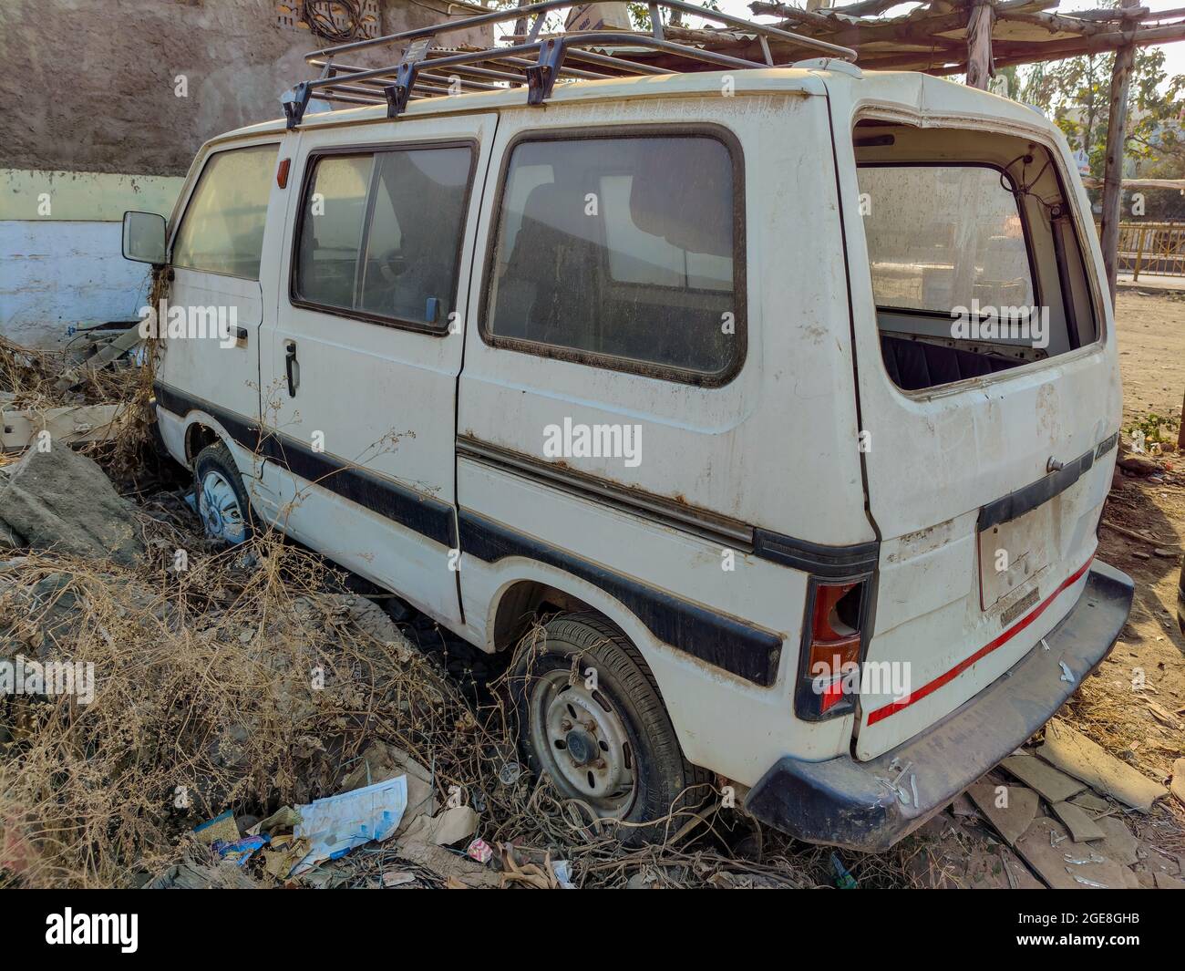 Abandoned wrecked white color van parked in the yard Stock Photo - Alamy