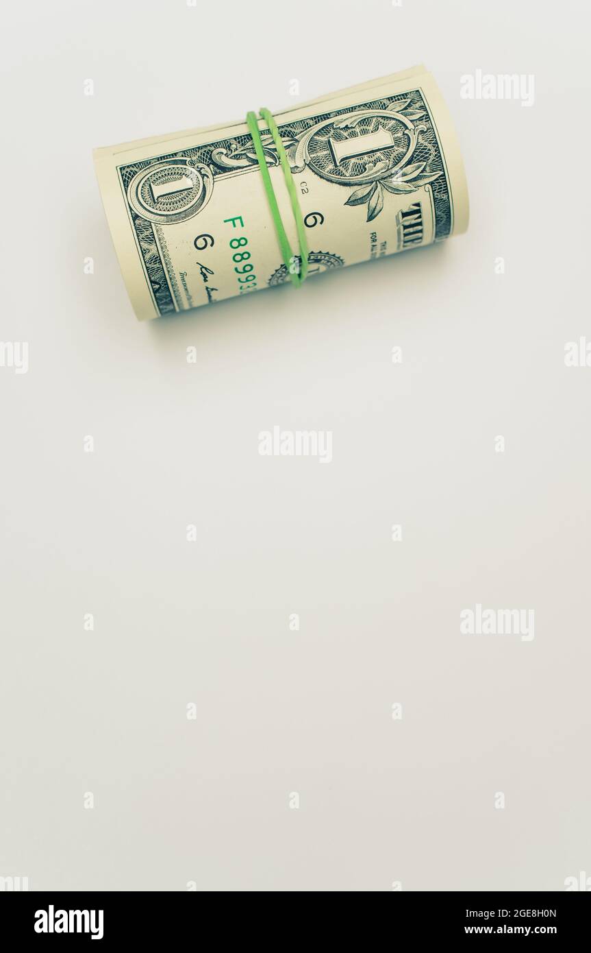 Roll of dollar paper bills isolated on a white background with free ...