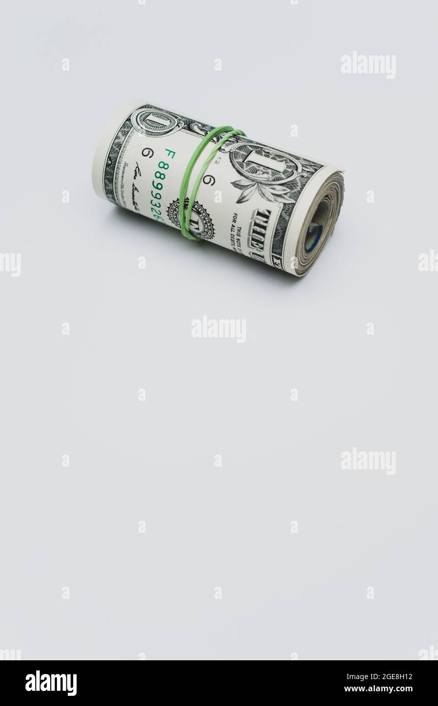 Roll of dollar paper bills isolated on a white background with free ...