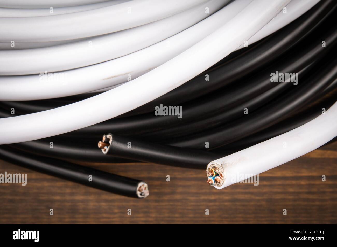 White and black electric cables. For interior installation and exterior ...