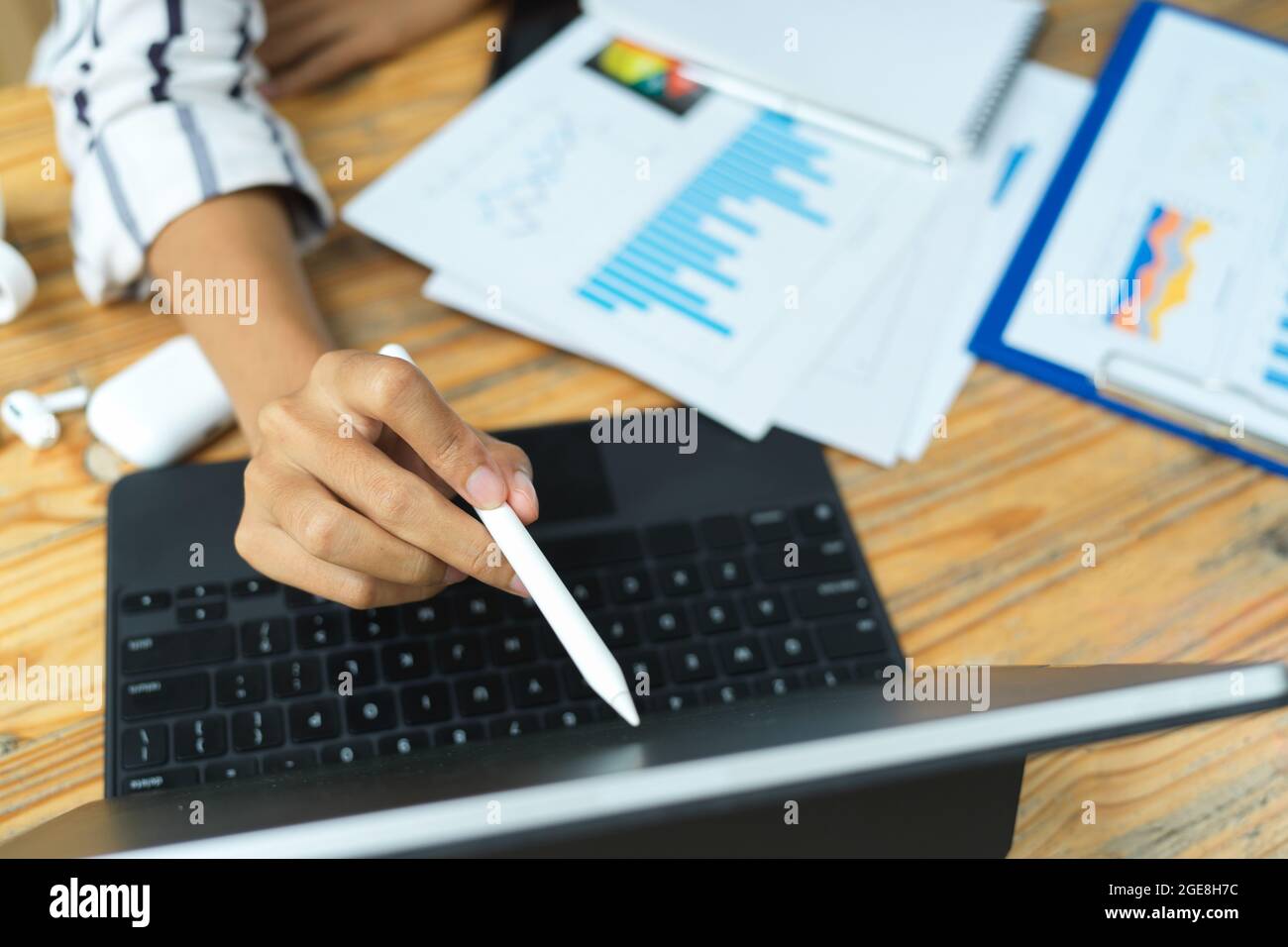 Business worker using stylus pen and portable tablet to create business ...
