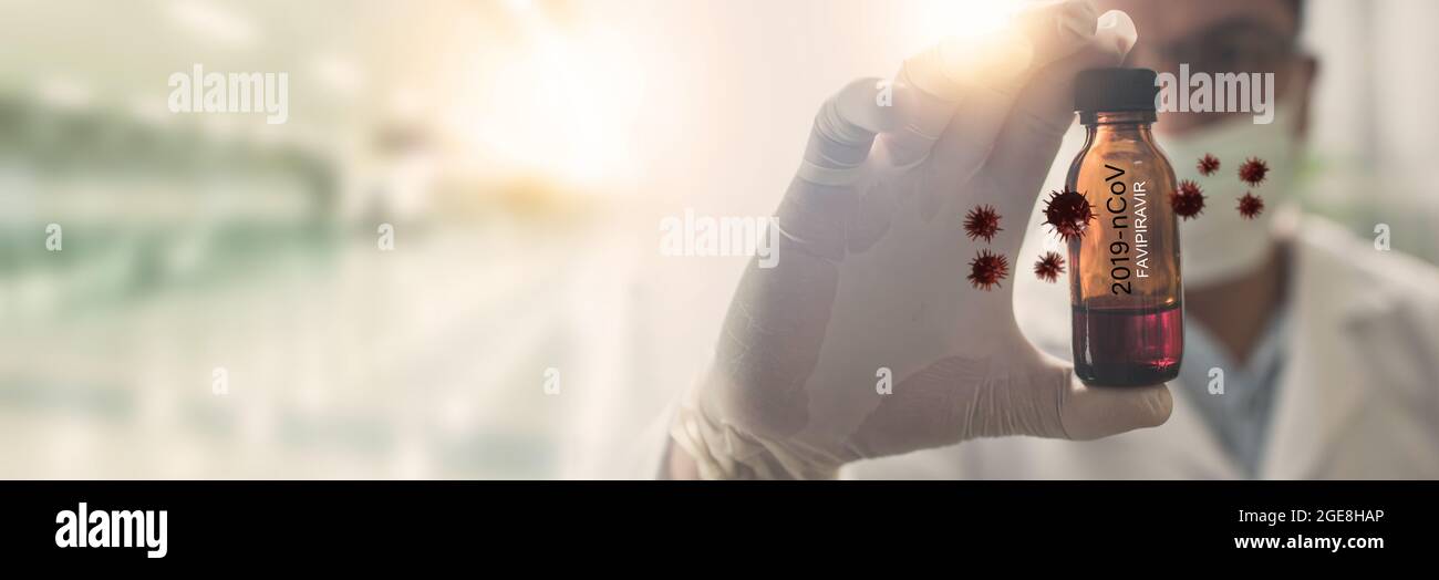Close up researcher or holding bottle Antiretroviral drugs of corona ...