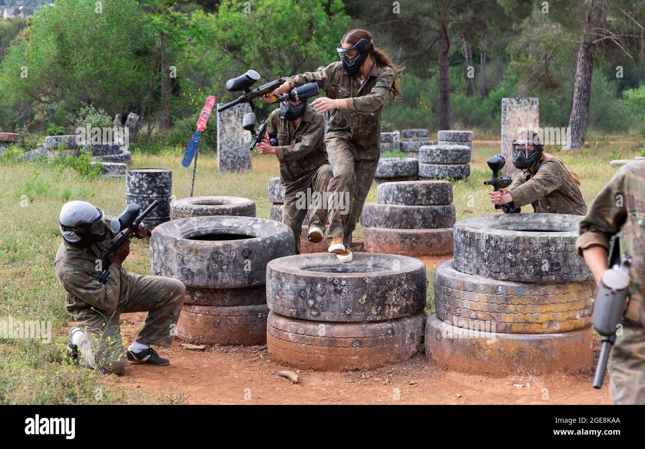 Two active opposing teams with guns playing paintball Stock Photo - Alamy Two active opposing teams with guns playing paintball Stock Photo - Alamy