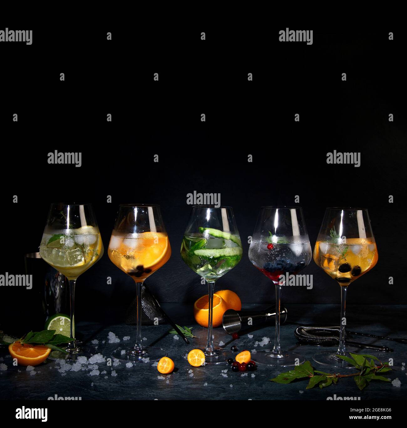 Gin cocktails assortment served on dark background. Creative drinks ...