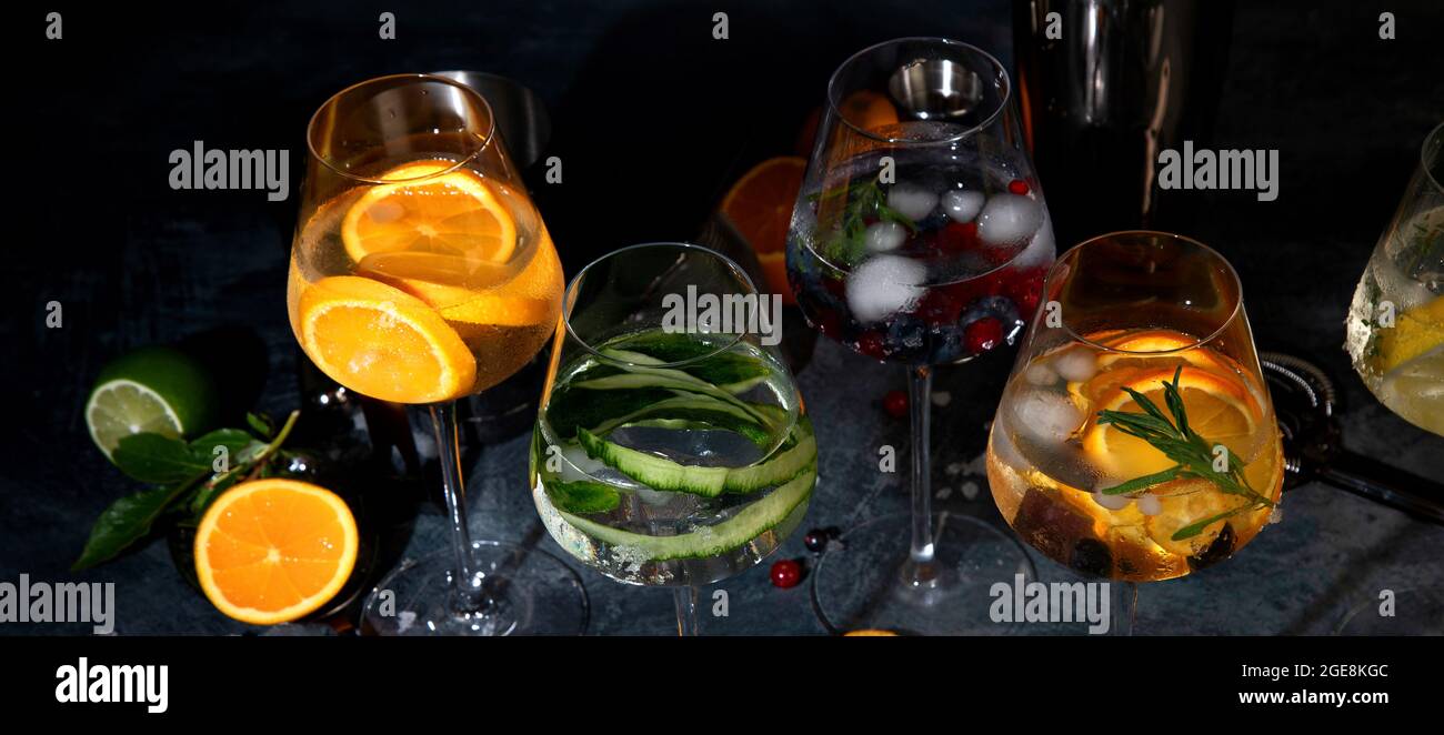 Gin cocktails assortment served on dark background. Creative drinks ...