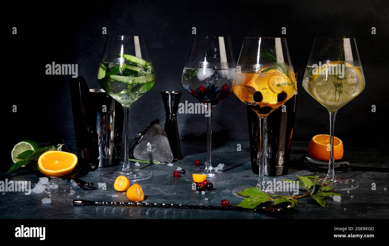 Gin cocktails assortment served on dark background. Creative drinks ...