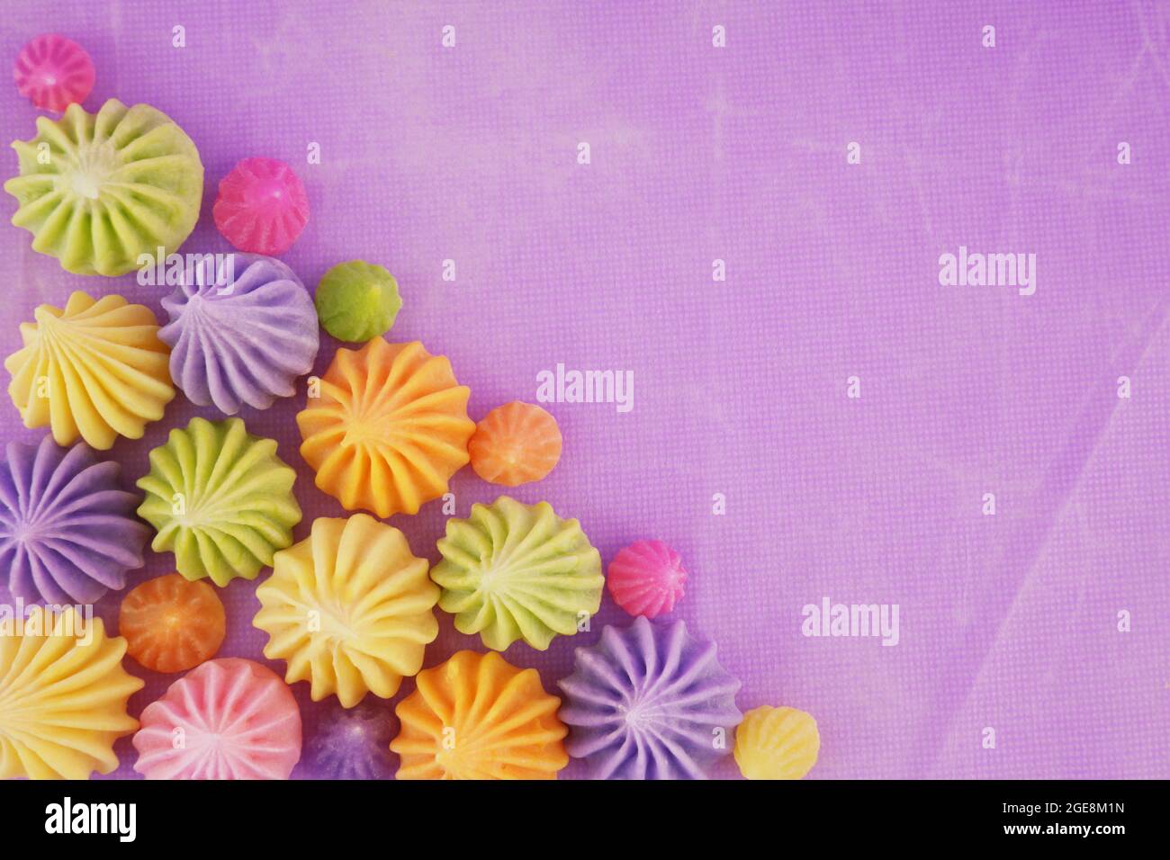 Multi-colored Thai desserts on a purple background.Thai dessert called ...