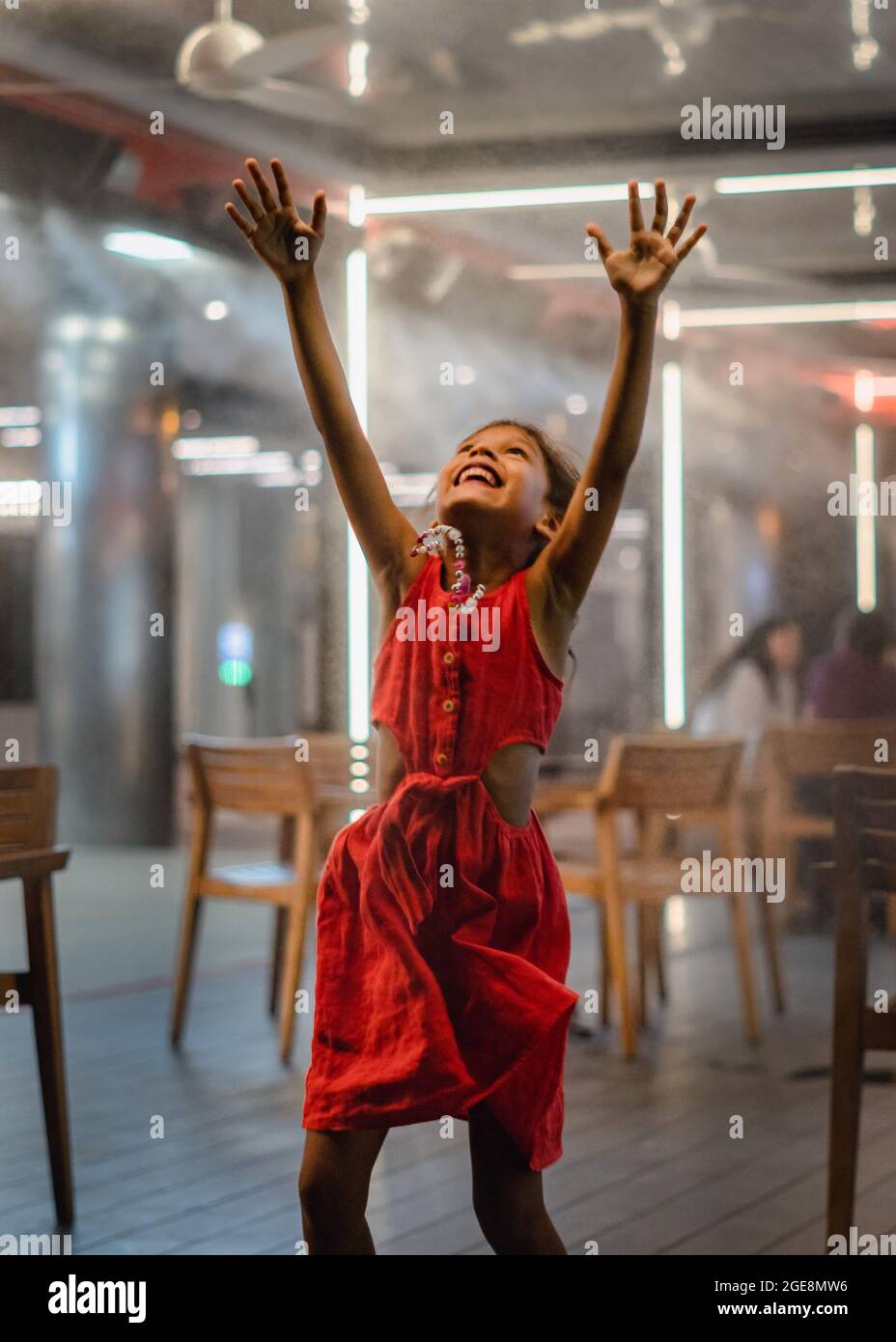 Little child playing with the Mist Water Sprayers Stock Photo - Alamy