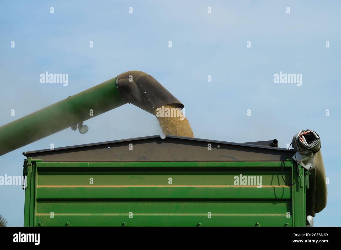 Combine harvester emptying grain hi-res stock photography and images ...