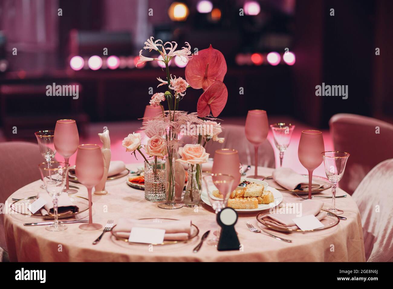 Romantic dinner pink decor table at restaurant Stock Photo - Alamy