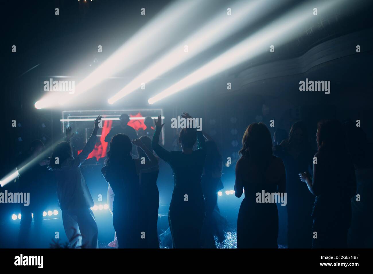 Silhouettes of a crowd on show in night club celebration Stock Photo ...
