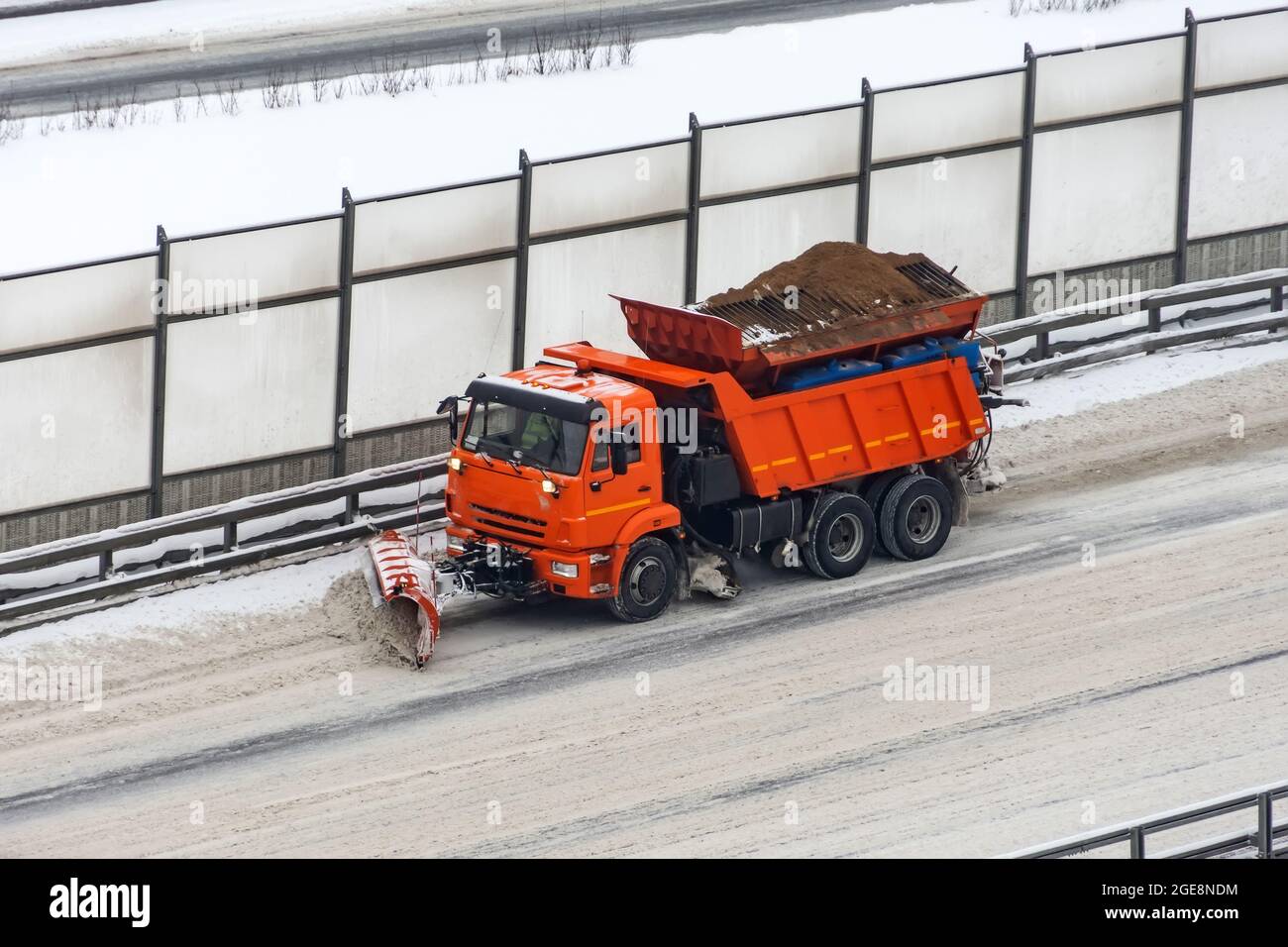 Snowplows removing the snow the highway on a cold snowy winter day ...