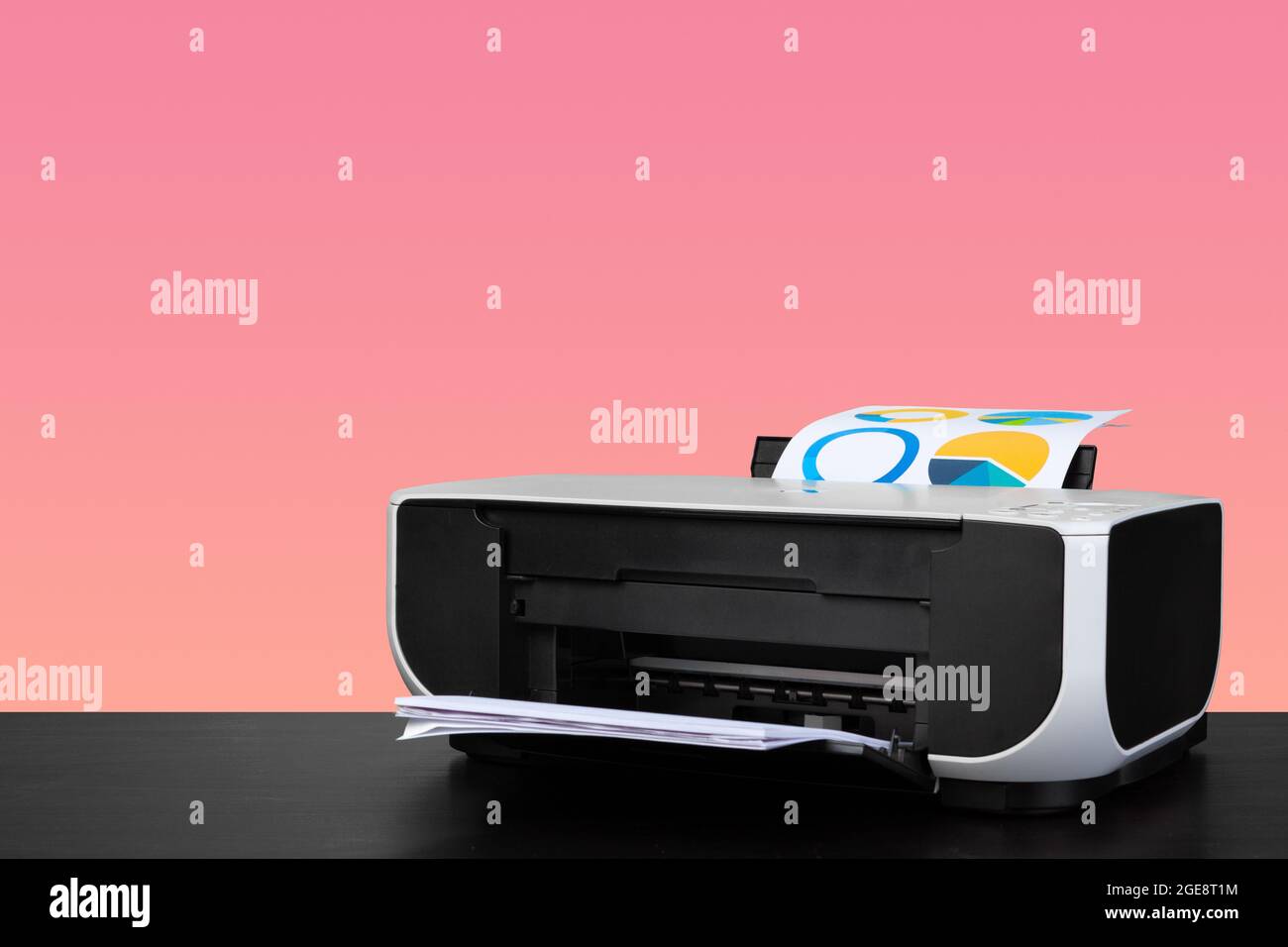 Compact home laser printer against pink background Stock Photo - Alamy