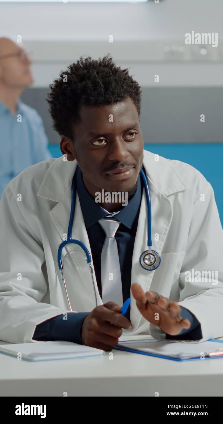 Multi ethnic doctor and old patient doing checkup with green screen on ...