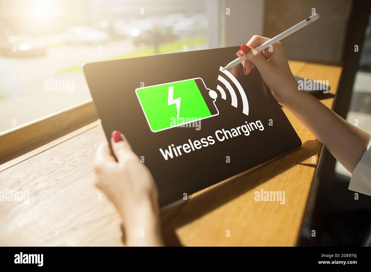Wireless charging icons and progress bar on device screen Stock Photo ...