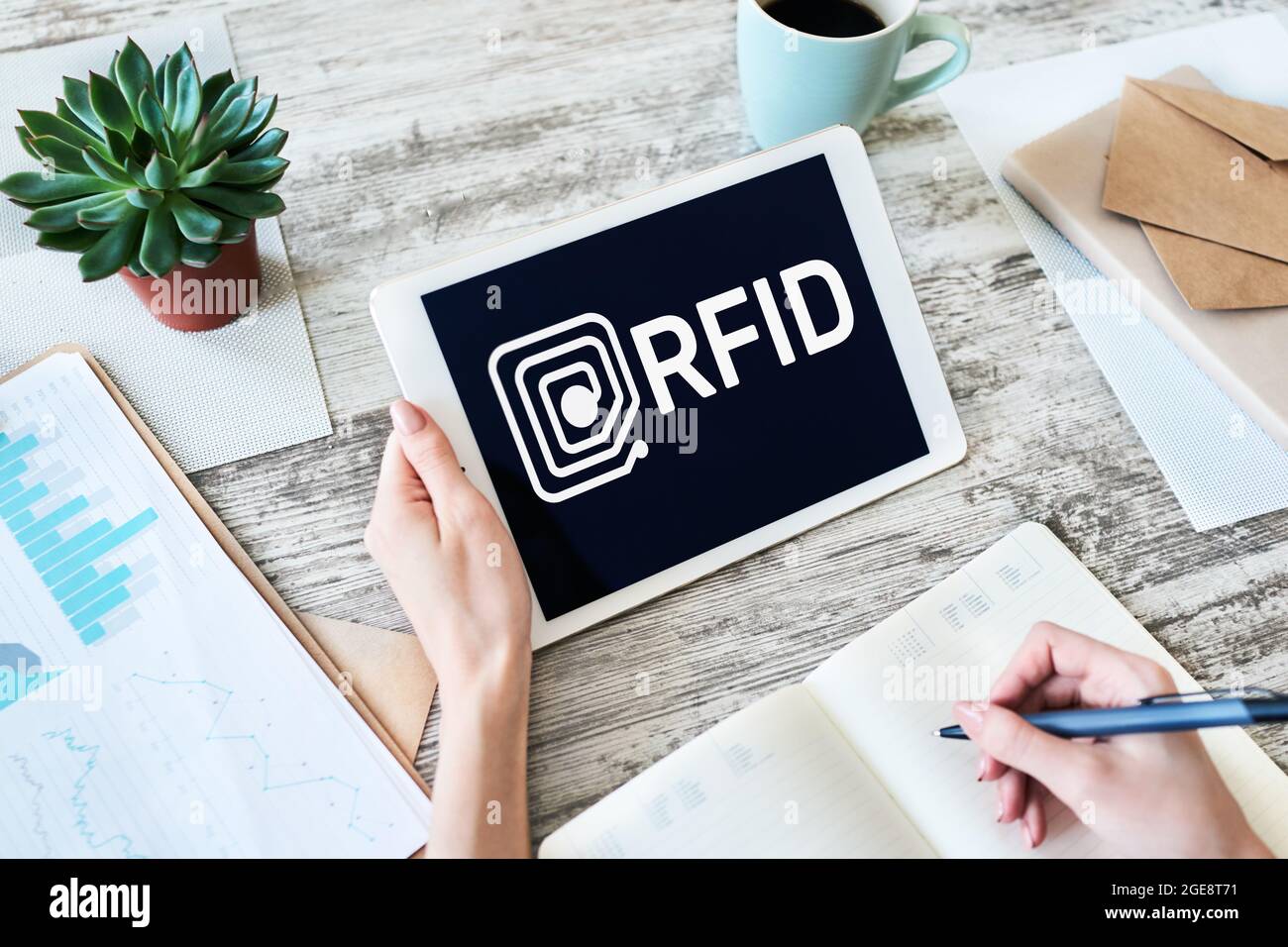 RFID Radio frequency identification technology concept on device screen ...