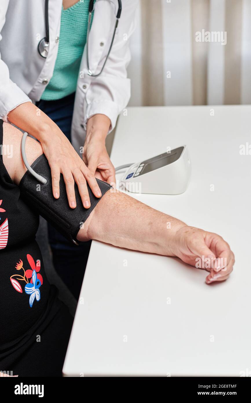 Doctor checking patient blood test hi-res stock photography and images ...