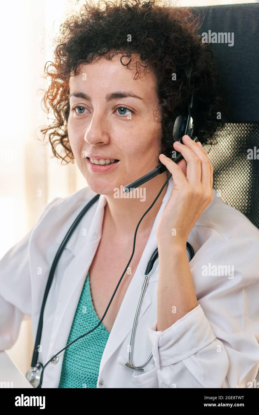 Close-up shot of a female insurance doctor attends to patients via ...