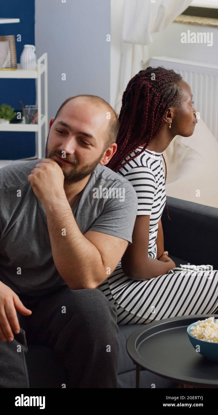 Interracial Couple With Dispute And Marriage Problems Yelling On Couch