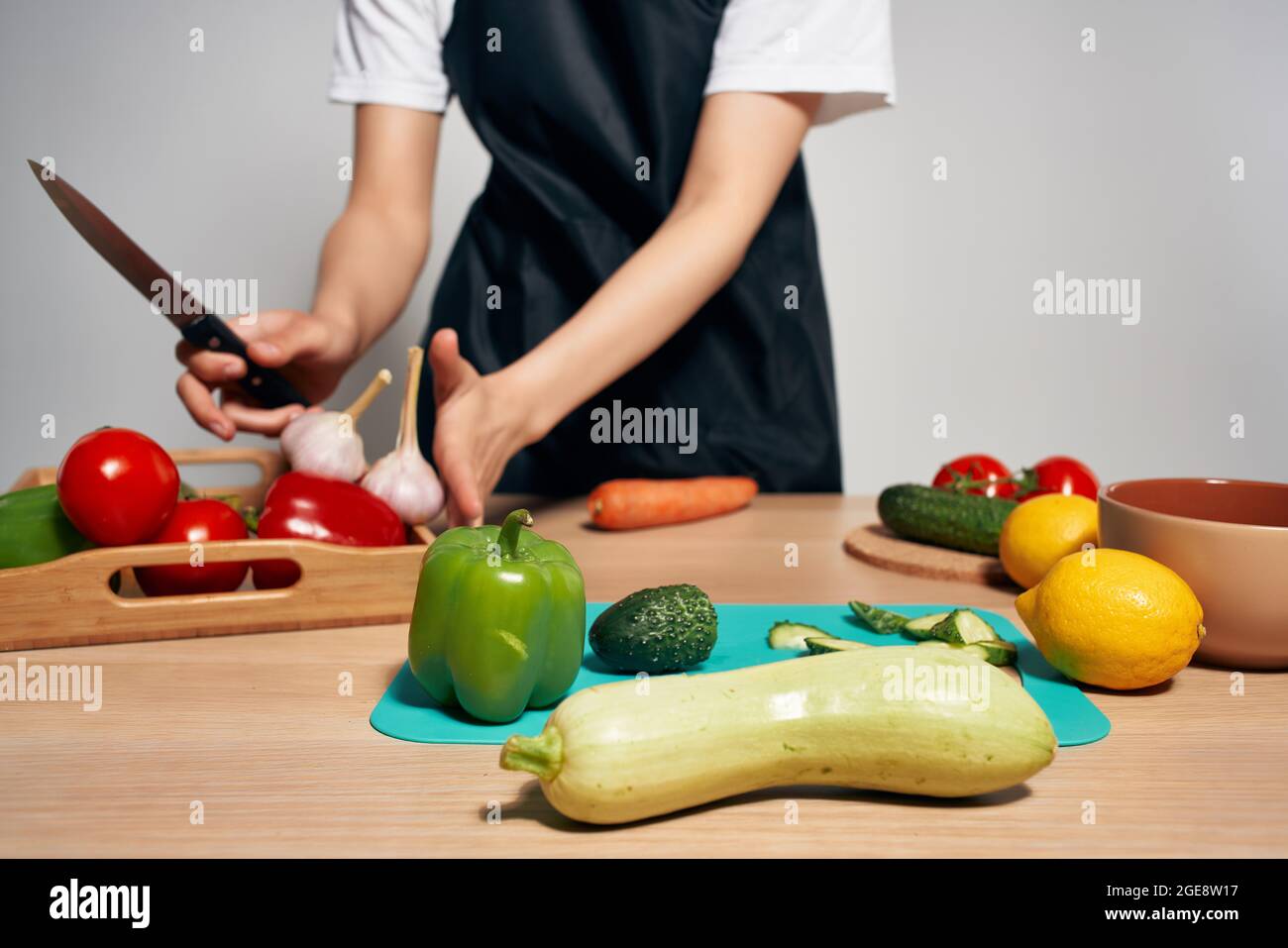 Woman in black apron Cooking healthy eating isolated background Stock ...