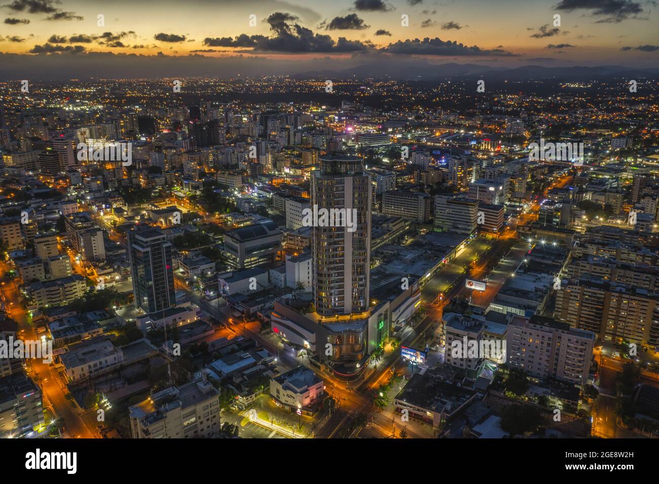 Cityscape of Santo Domingo surrounded by lights in the evening in the ...