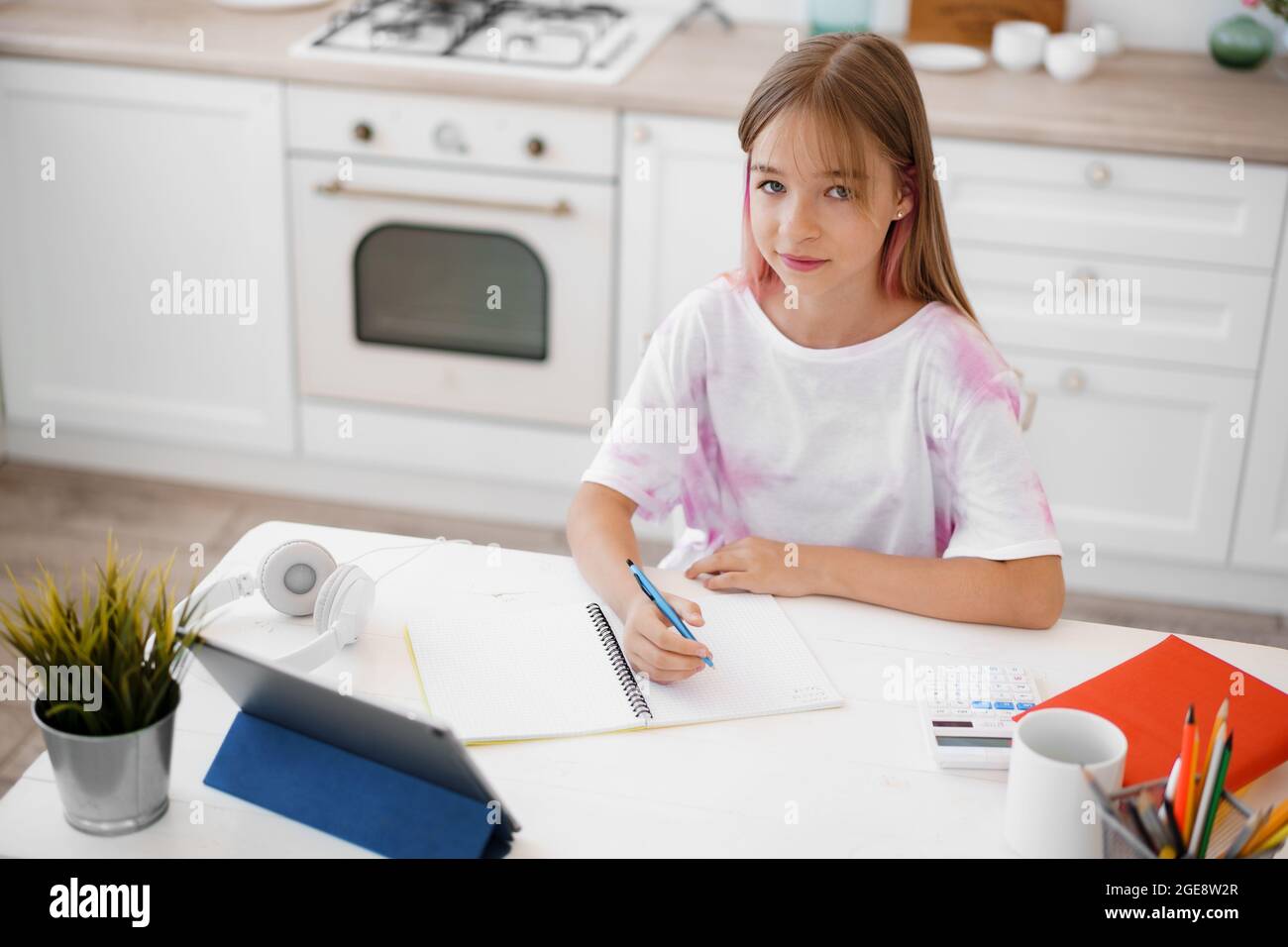 Homeschooled little young girl student having online class using ...