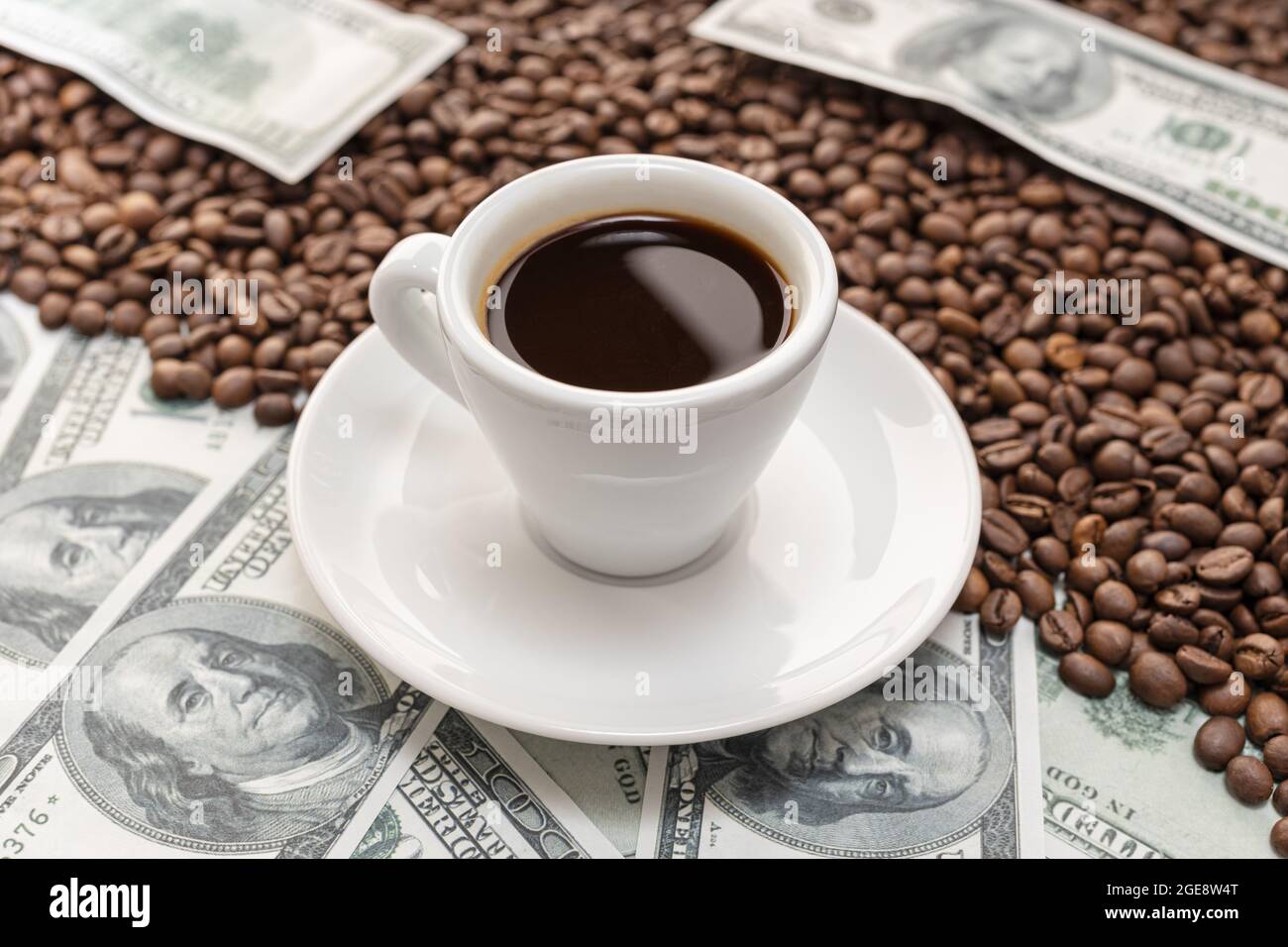Cup of coffee on Coffee beans and dollar banknotes background Stock ...