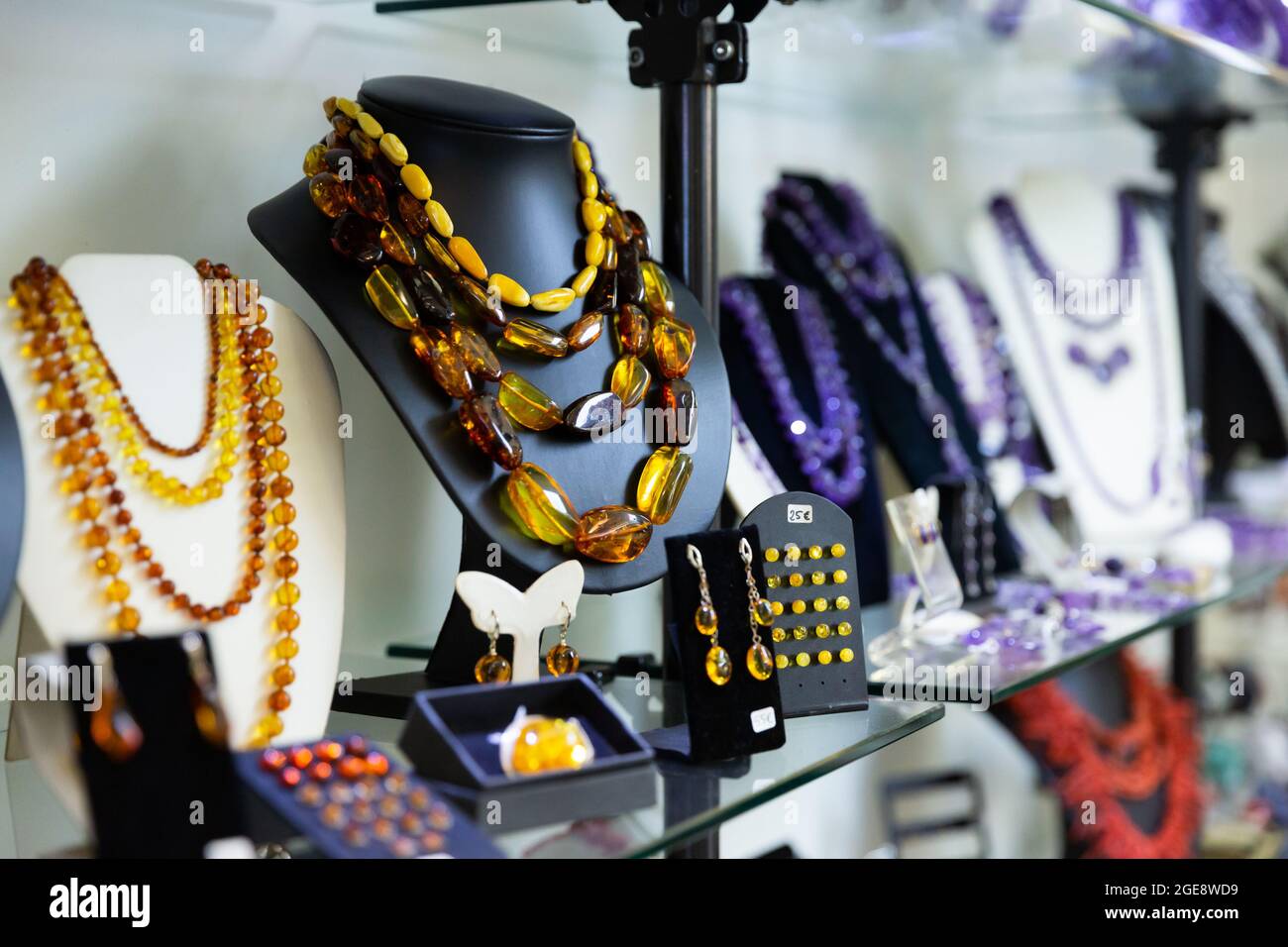 Jewelry made of amber on display Stock Photo - Alamy