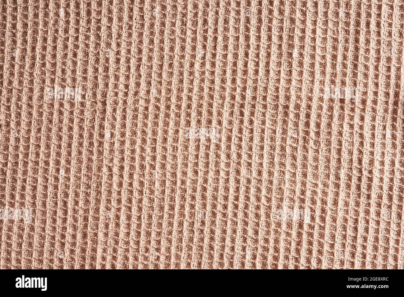 Closeup of a rough textured paper with golden thread for background or ...
