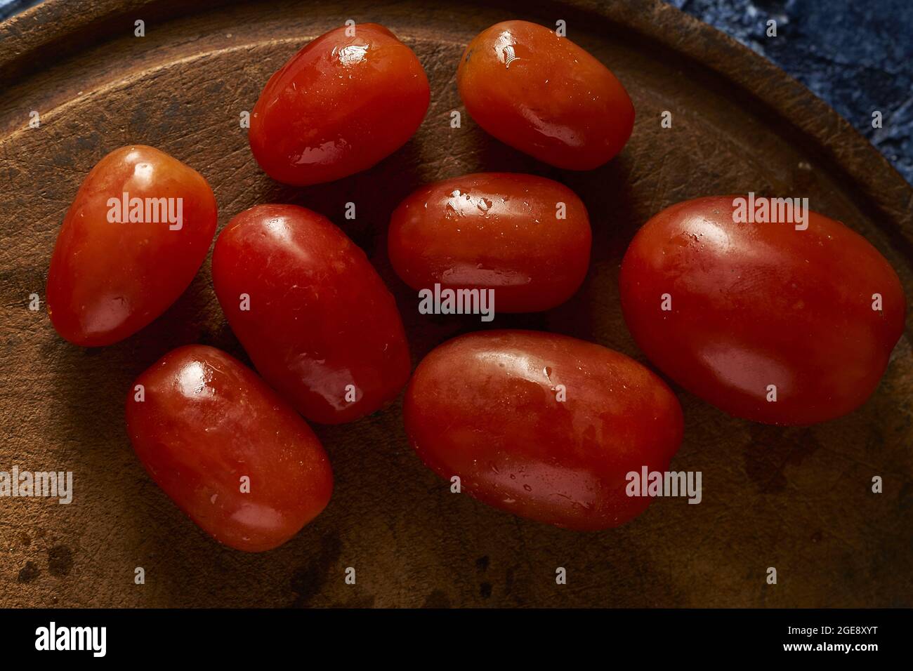 Closeup shot of fresh cherry tomatoes wood dish Stock Photo - Alamy
