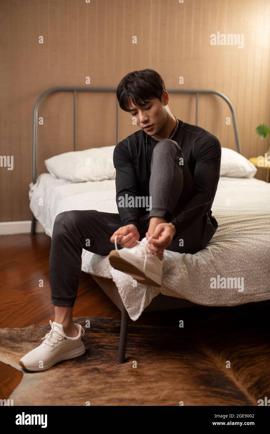 Man and bed one man only getting up hi-res stock photography and images ...