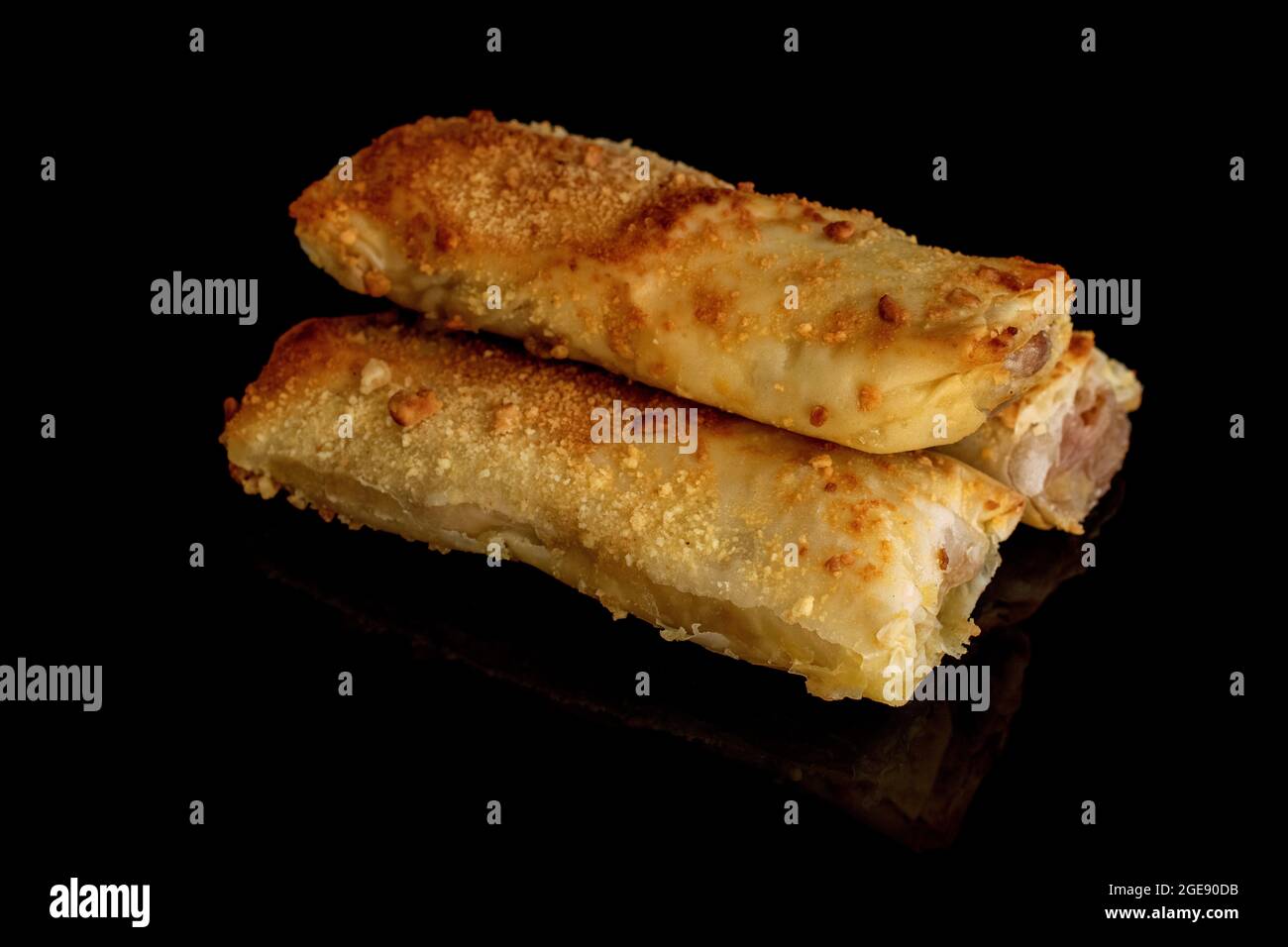 Three homemade apple mini strudel, close-up isolated on black Stock ...