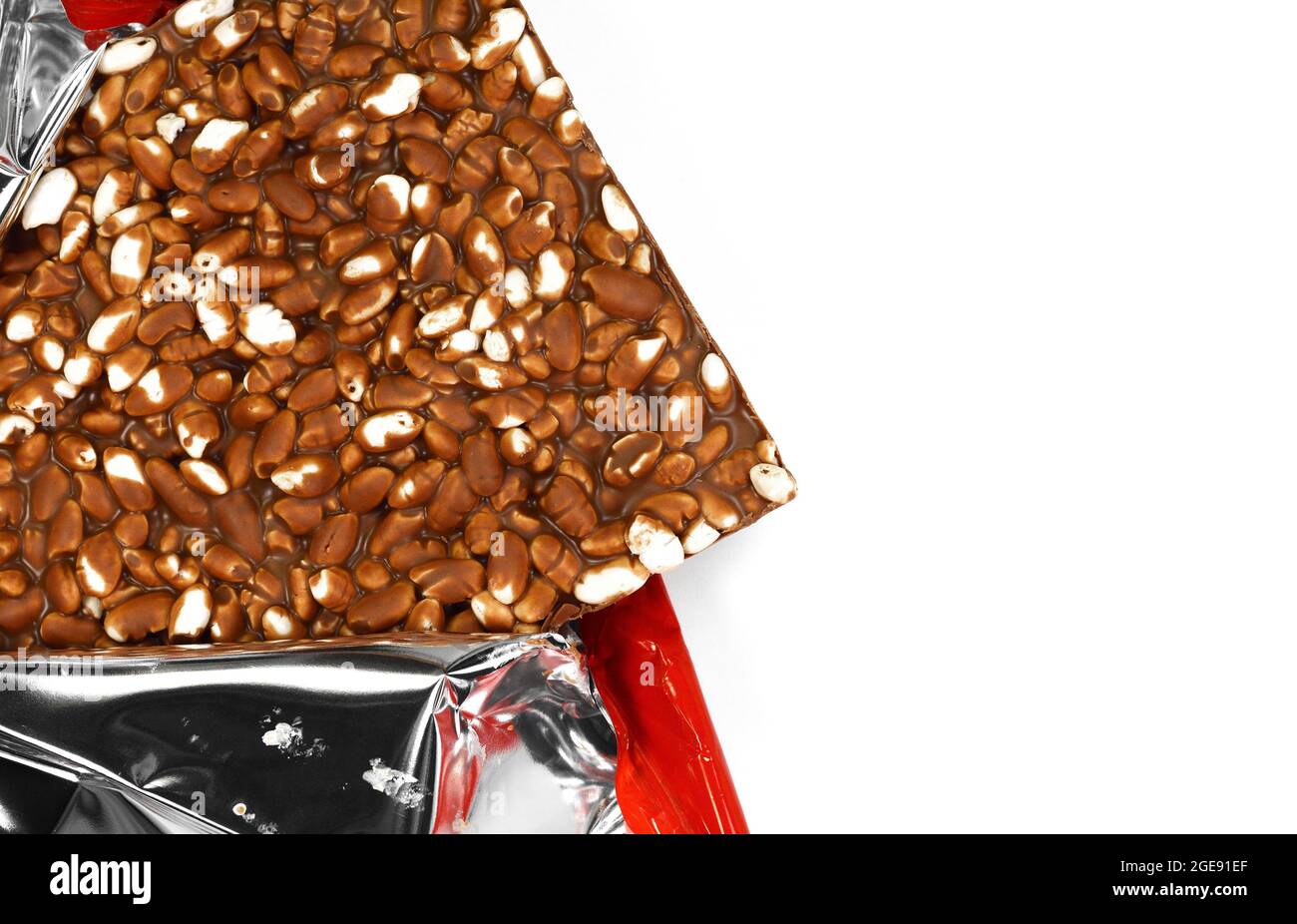 Chunks of milk chocolate with puffed rice isolated on white background ...