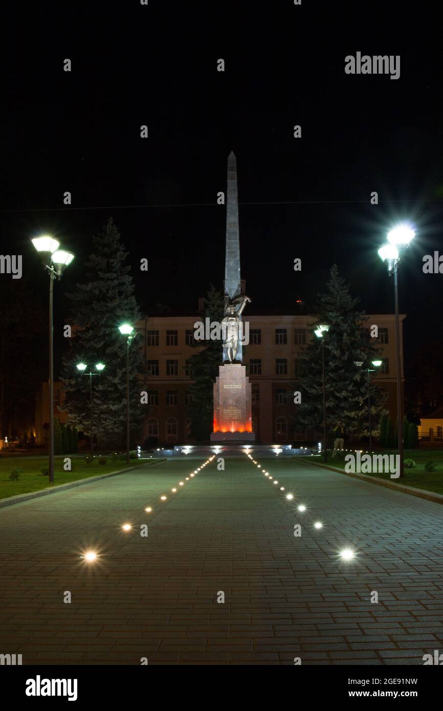 Monument-stele, illuminated by lights at night Stock Photo - Alamy
