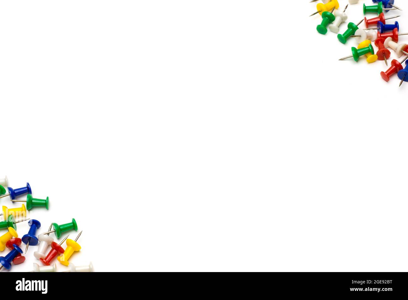 Colorful paper push pins in the corner on a white background with text ...