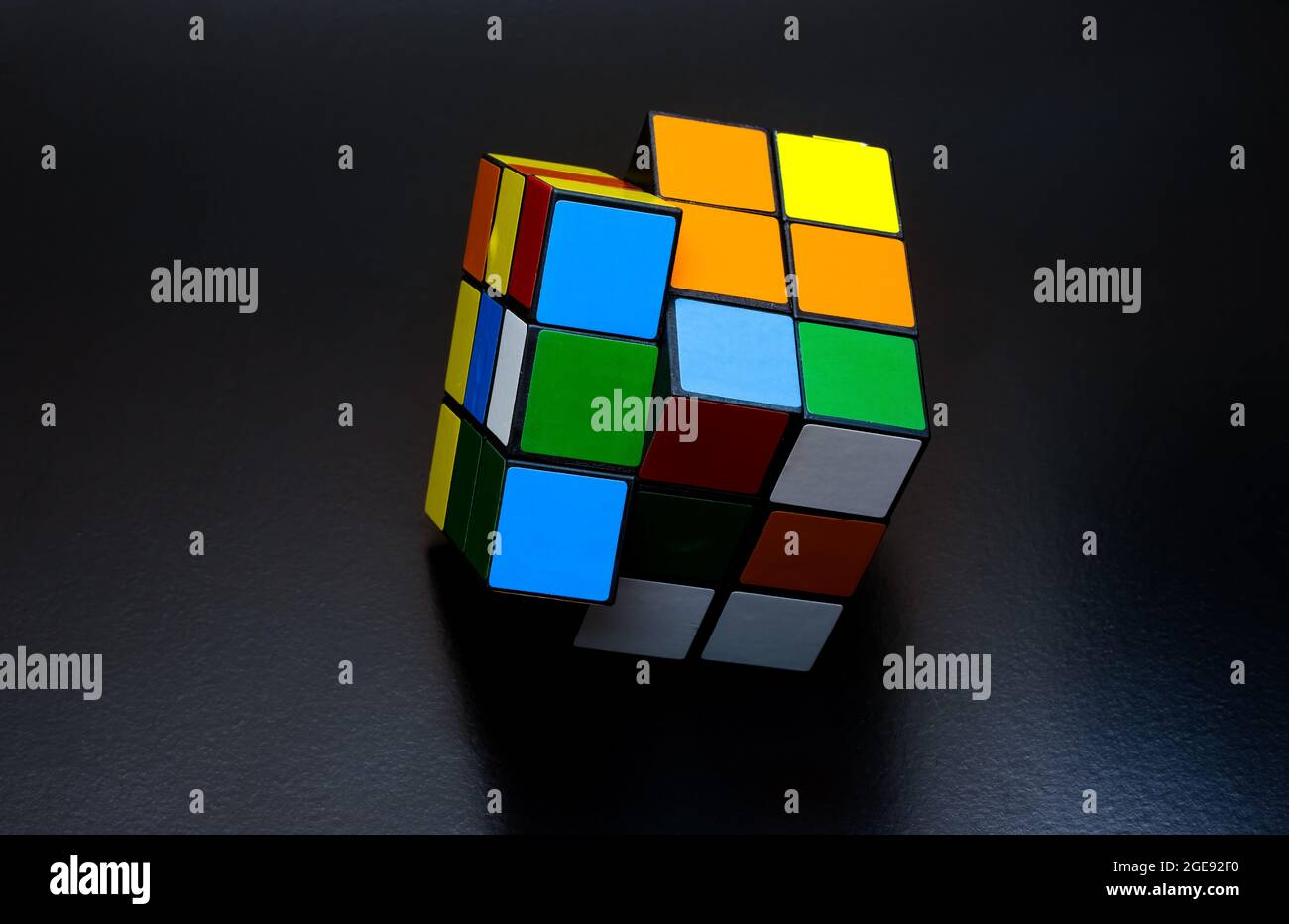 Perspective rubik cube with long shadow on rough dark background Stock ...