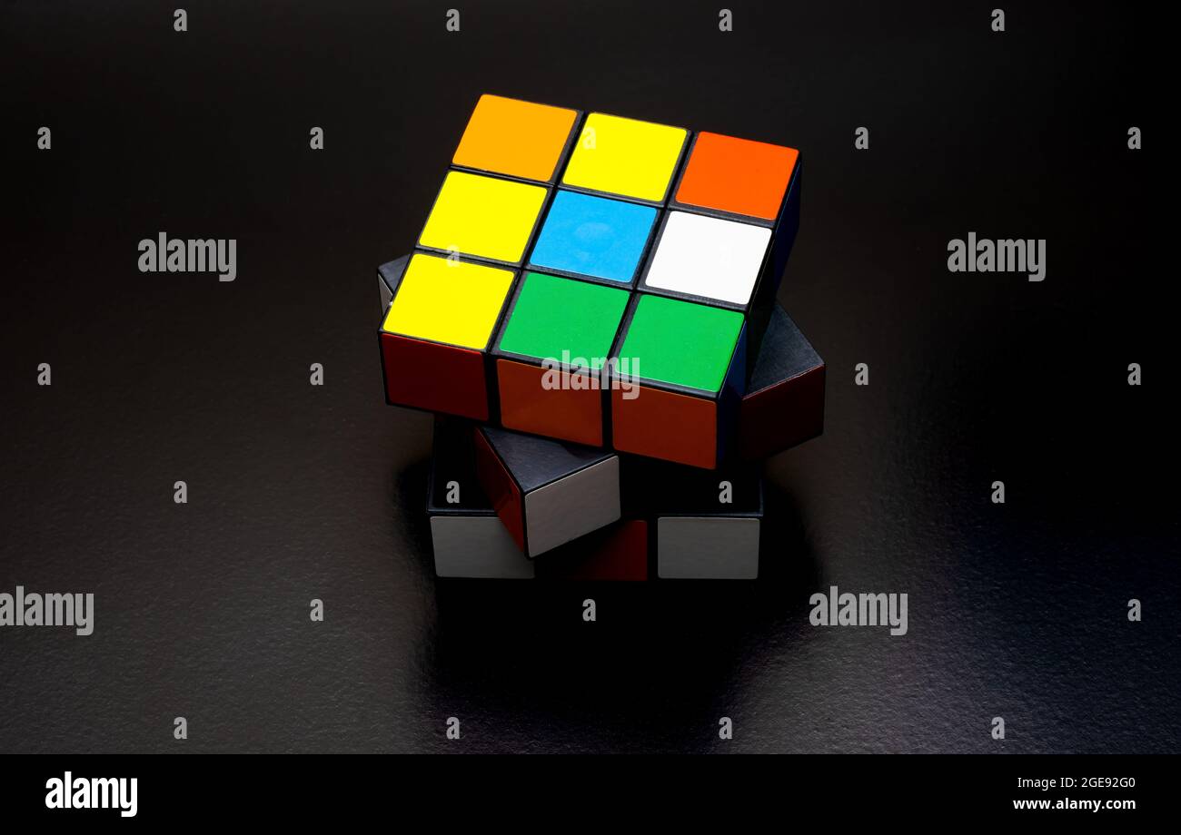 Rubik cube front view with long shadow on rough dark background Stock ...