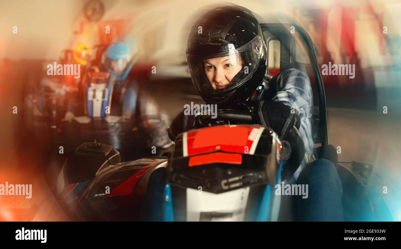 woman driving racing car at kart circuit Stock Photo - Alamy