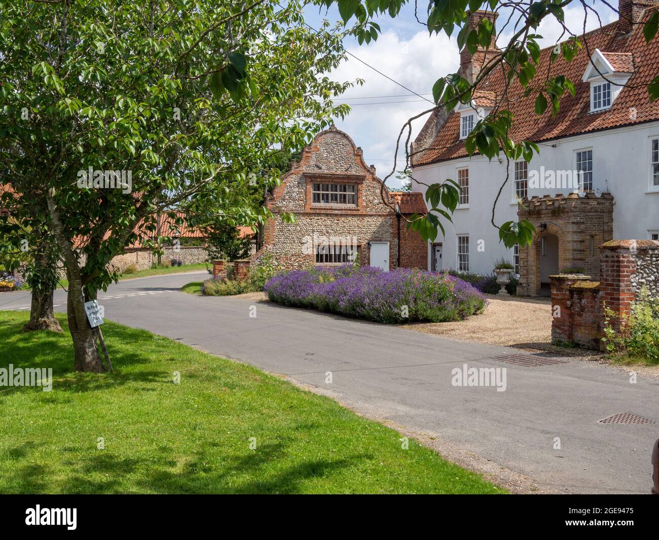 Summer street scene in the village of Binham, North Norfolk, UK Stock ...